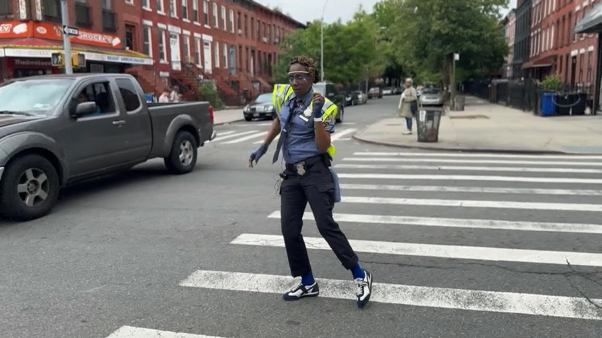 Watch CBS Mornings: Meet the NYC crossing guard with smooth moves ...