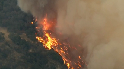 Watch CBS Evening News: Arson suspect detained as fire rages in ...